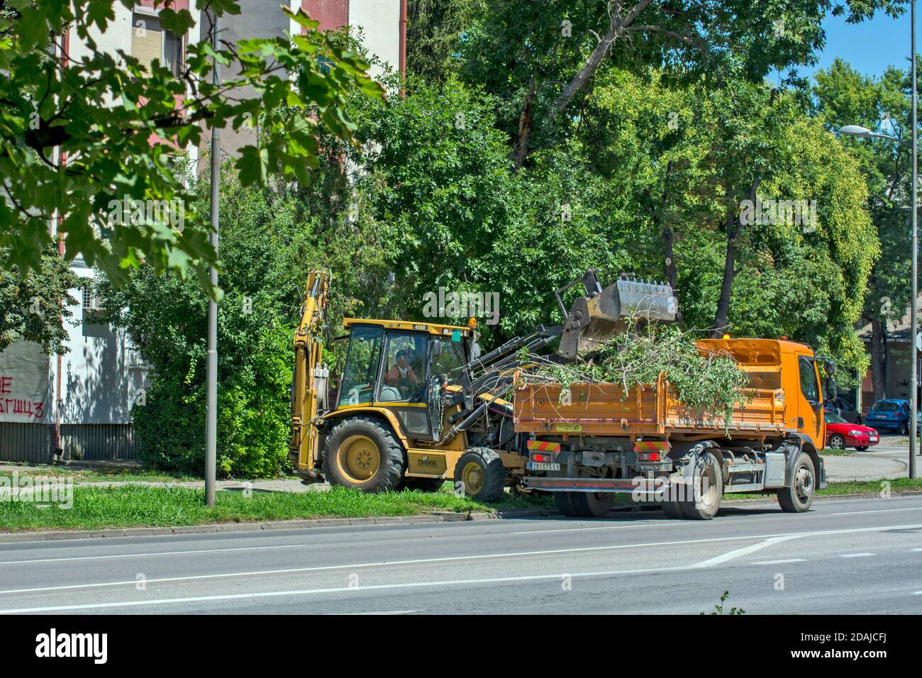 Zrenjanin, July 29, 2020. Mechanized loading of communal rubble into a ...
