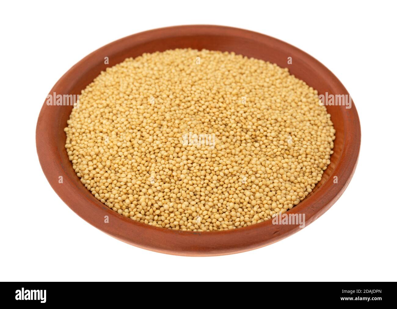 Side view of amaranth seeds in a small bowl isolated on a white ...
