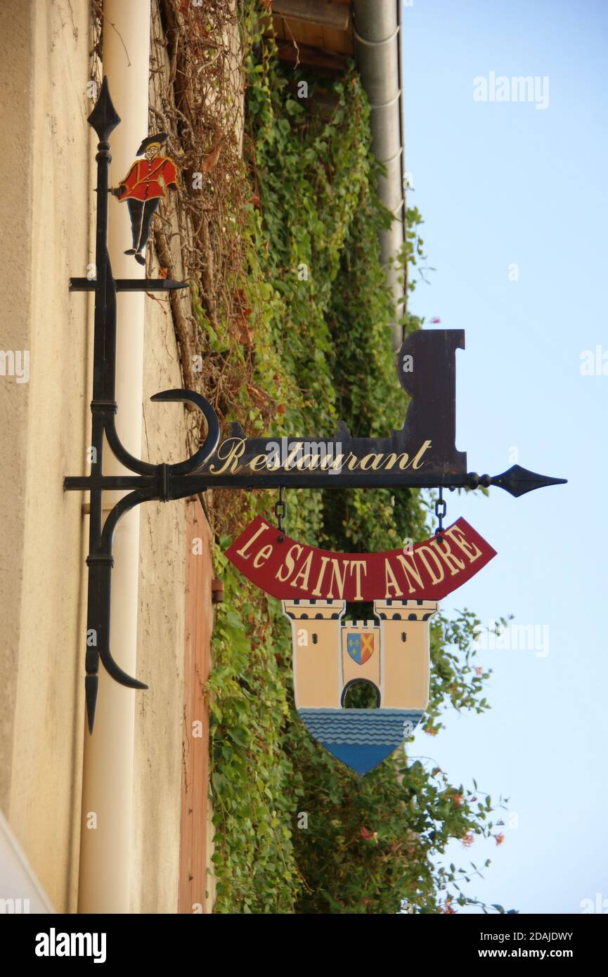 Restaurant sign showing the city gates in Villeneuve des Avignon Stock ...