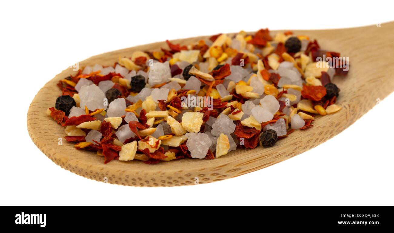 Side view of a portion of garlic and chili seasoning on a wood spoon ...