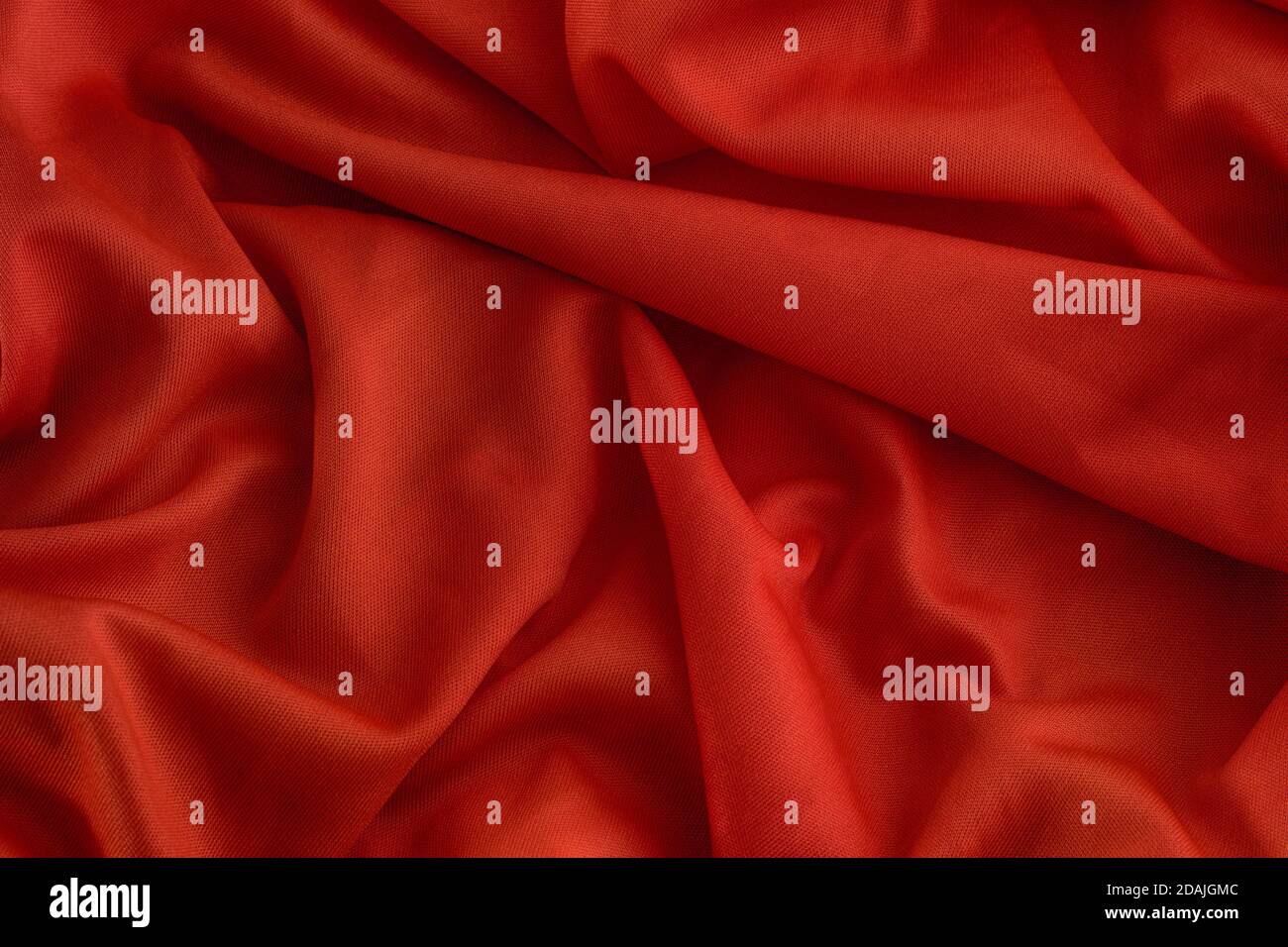 Red folded fabric texture background. Close up Stock Photo - Alamy