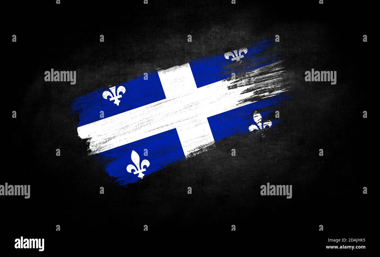 smear of paint in the form of the flag of Quebec close-up on a black ...