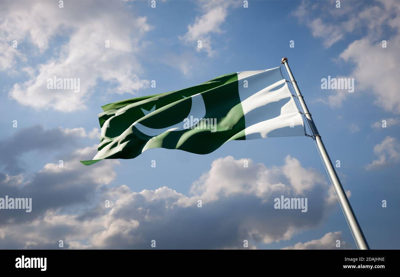 Beautiful national state flag of Pakistan fluttering at sky background ...