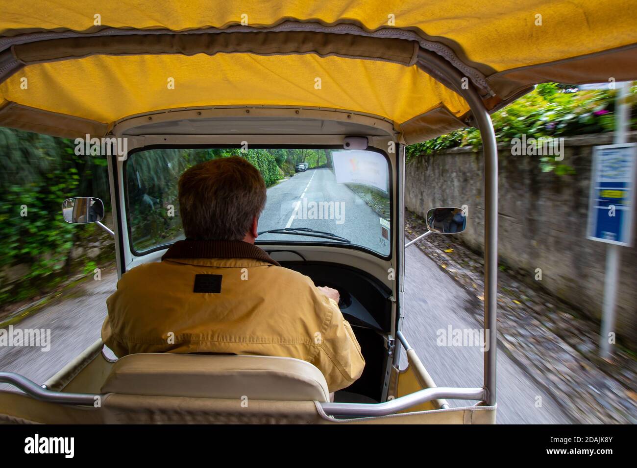 Man driving an auto-rickshaw in an empty street Stock Photo - Alamy