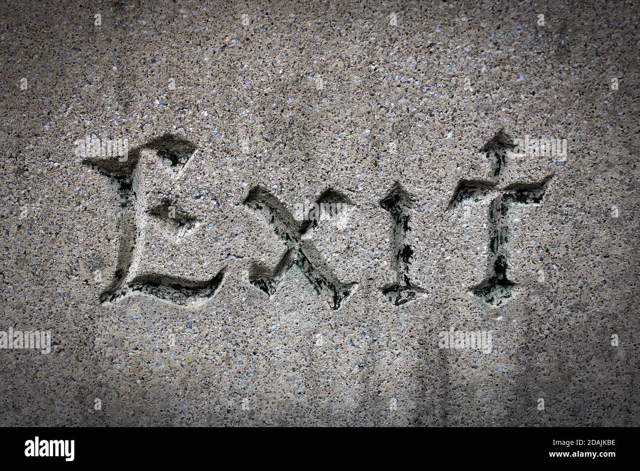 This exit sign is both the writing on the wall and written in stone ...