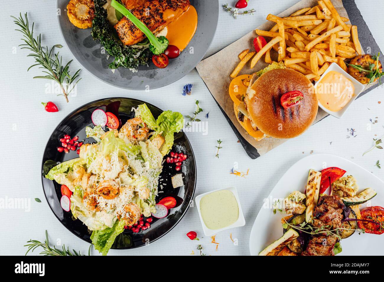 Top view of a restaurant table with delicious gourmet foods Stock Photo ...
