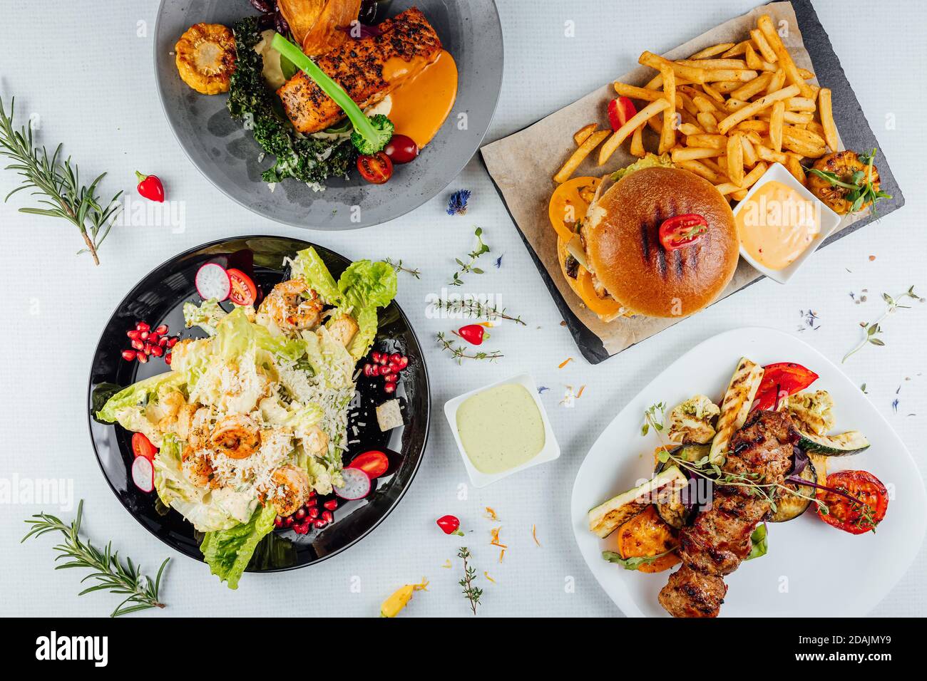 Top view of a restaurant table with delicious gourmet foods Stock Photo ...