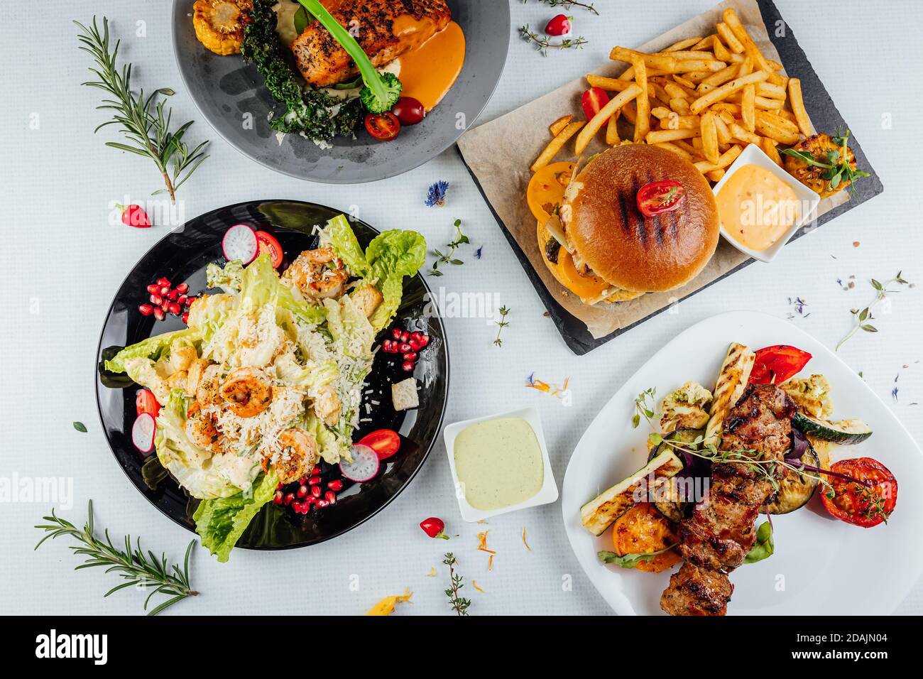 Top view of a restaurant table with delicious gourmet foods Stock Photo ...