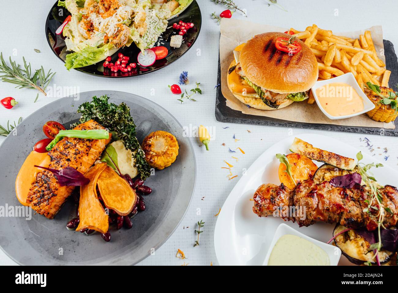 Gourmet restaurant table with delicious dishes Stock Photo - Alamy