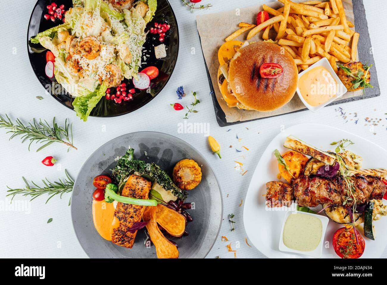 Top view of a restaurant table with delicious gourmet foods Stock Photo ...