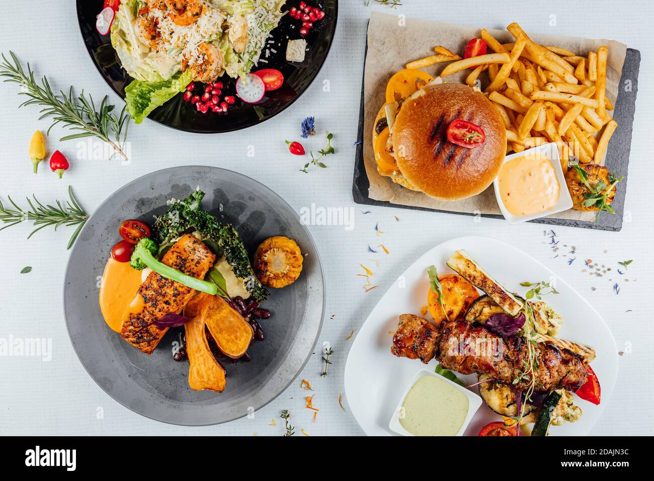 Top view of a restaurant table with delicious gourmet foods Stock Photo ...