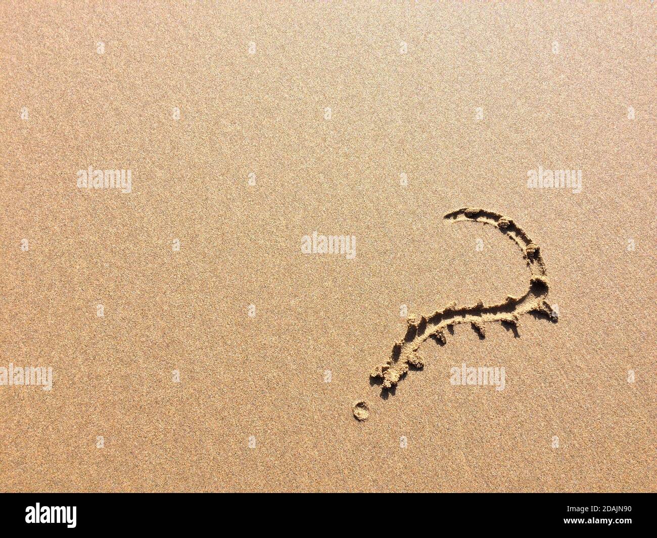 question mark drawn in the sand, a symbol of mystery and riddles Stock ...