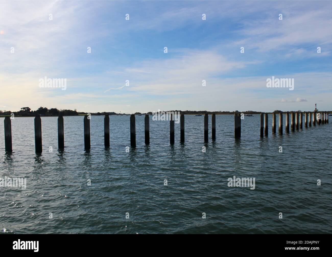 Mooring posts in Boham harbour adjacent to the quay Stock Photo - Alamy