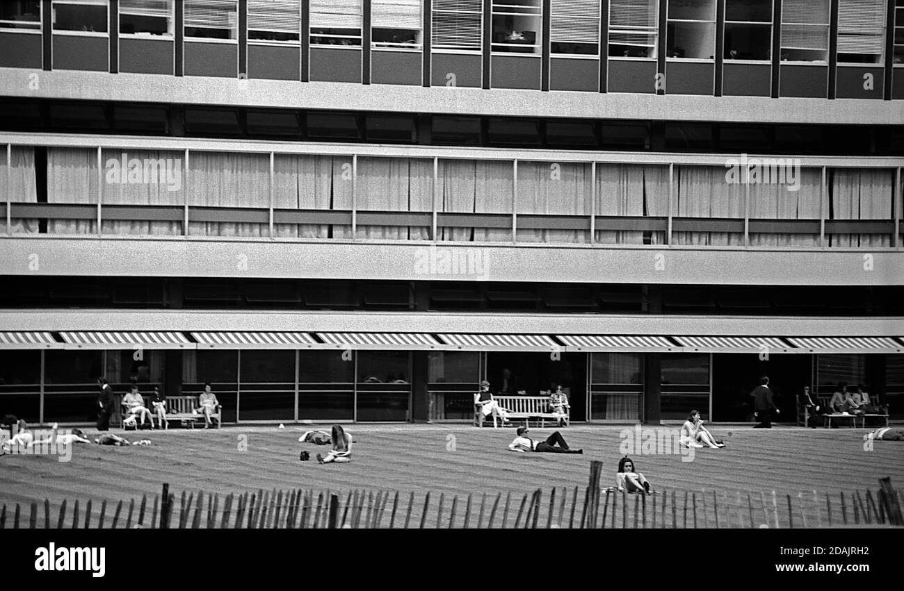Students rest on the grass, London, England, 1971 Stock Photo - Alamy