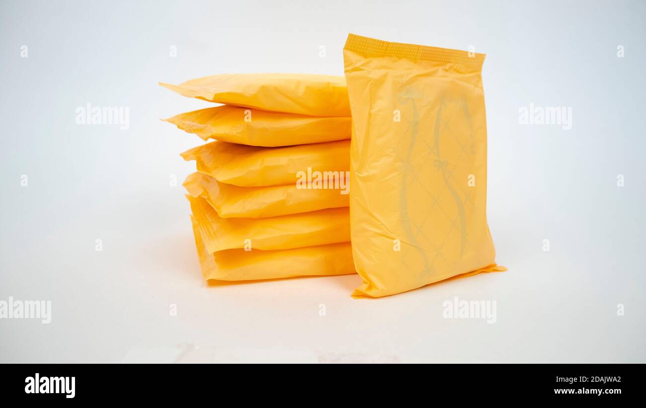 Sanitary pads in orange package, hygiene towels, menstruation period ...