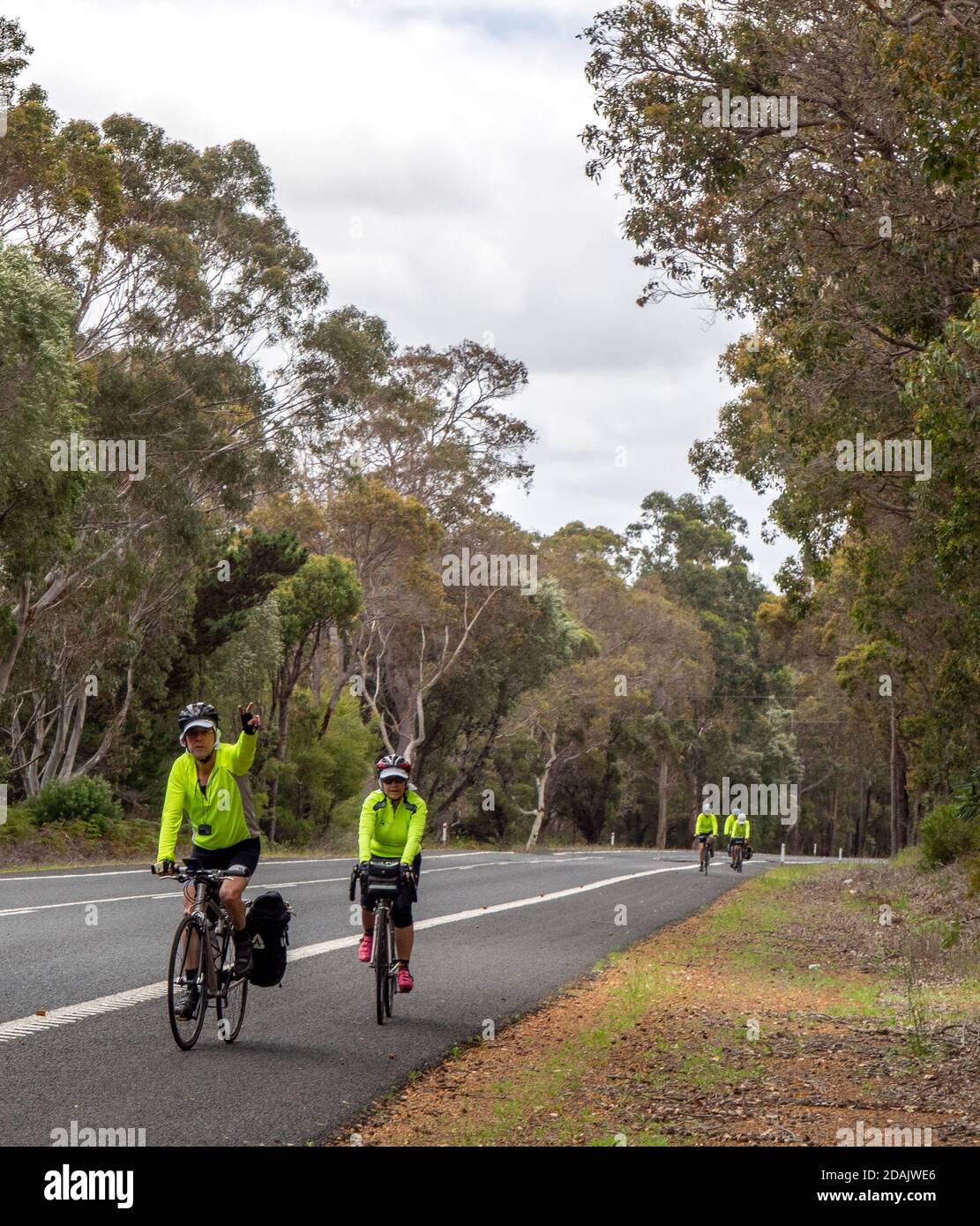 Touring cyclists travelling on vacation riding bicycles on a country ...