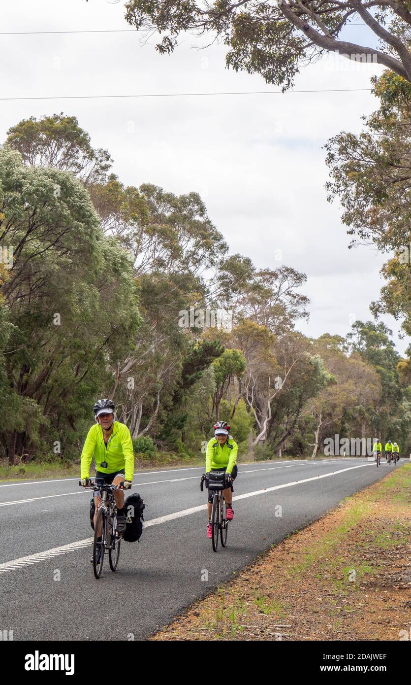 Touring cyclists travelling on vacation riding bicycles on a country ...