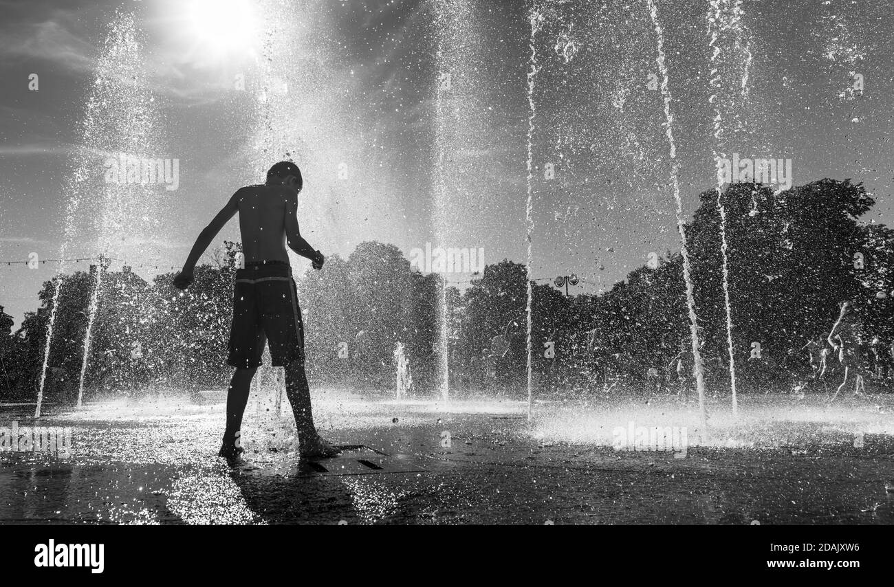 UZHGOROD, UKRAINE - May 28, 2017: Happy children playing in a water ...