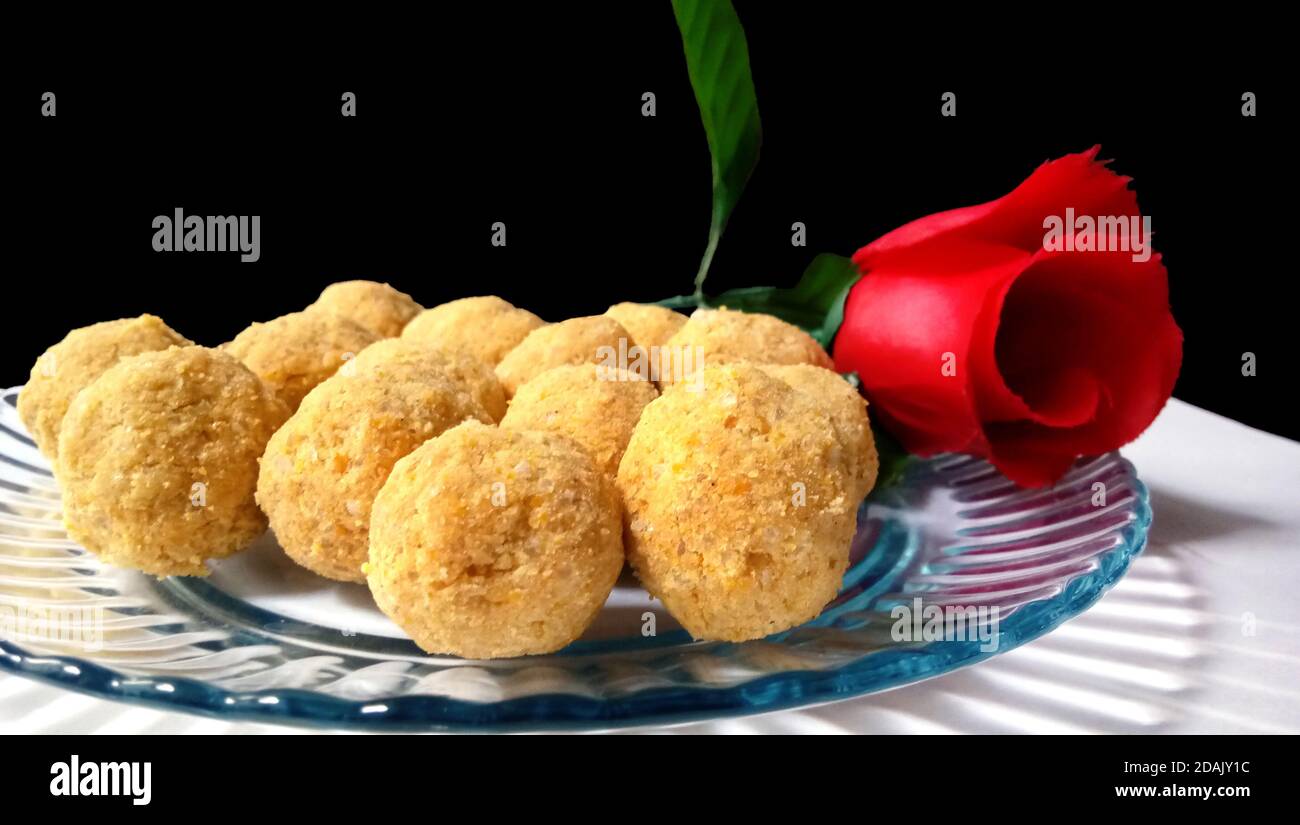 A mouth watering sweet - Besan laddoo made by roasted gram flour, ghee ...