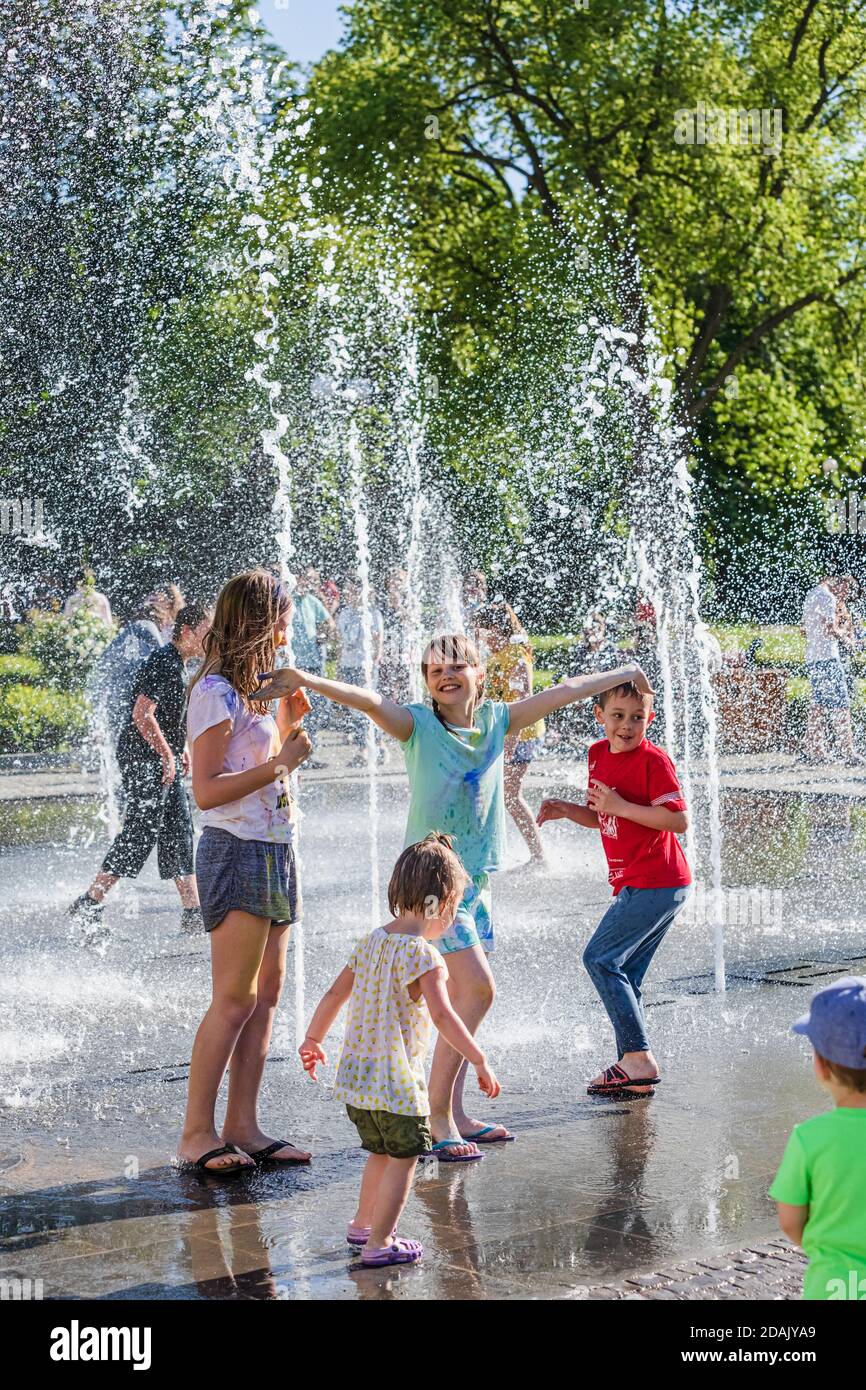 UZHGOROD, UKRAINE - May 28, 2017: Happy children playing in a water ...
