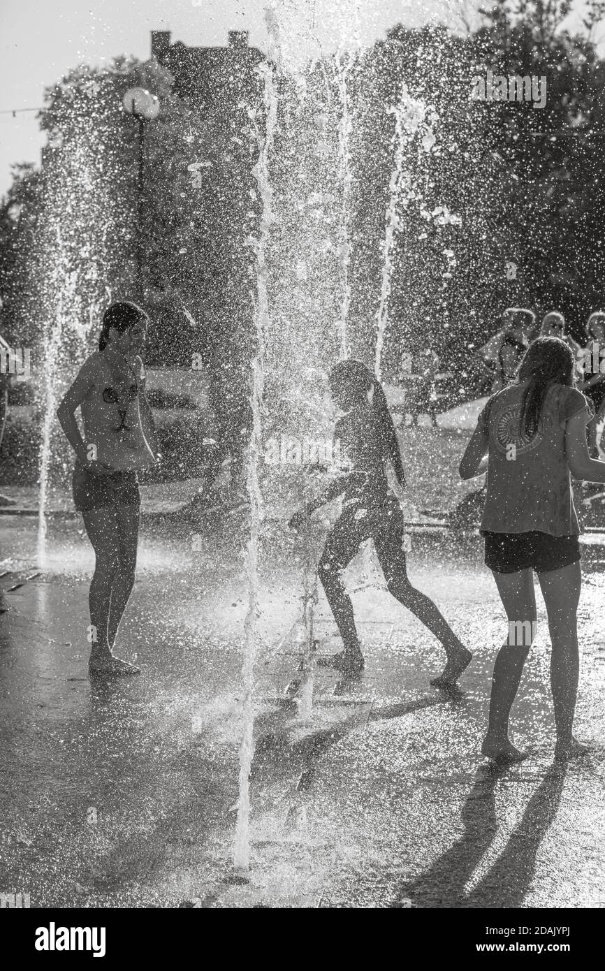 UZHGOROD, UKRAINE - May 28, 2017: Happy children playing in a water ...