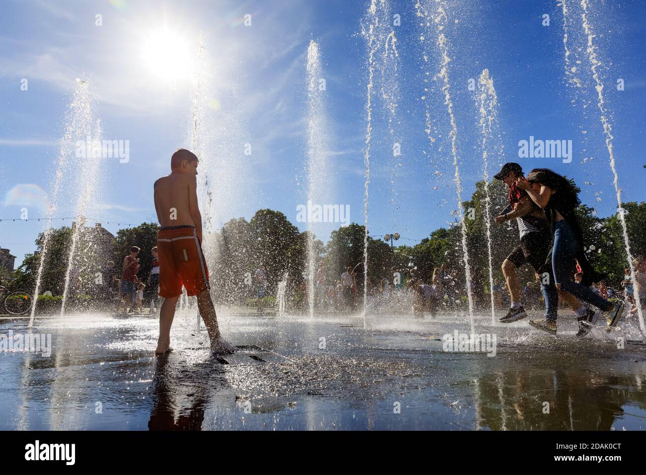 UZHGOROD, UKRAINE - May 28, 2017: Happy children playing in a water ...