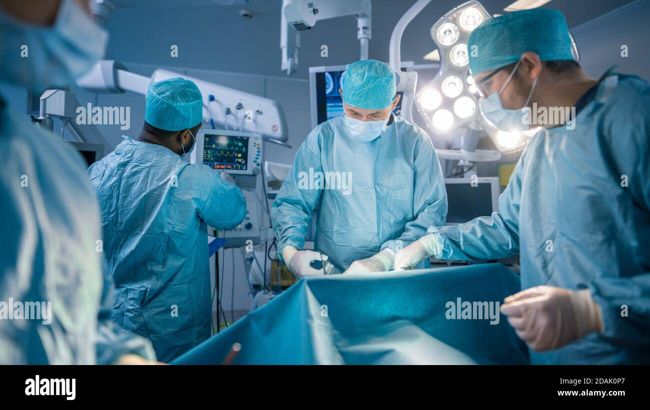 Diverse Team of Professional surgeon, Assistants and Nurses Performing ...