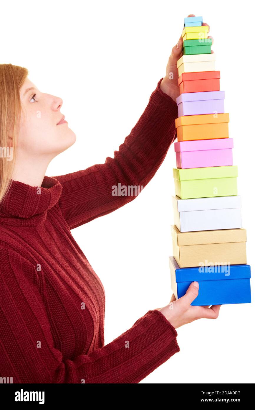 Laughing woman with lots of colorful boxes Stock Photo - Alamy