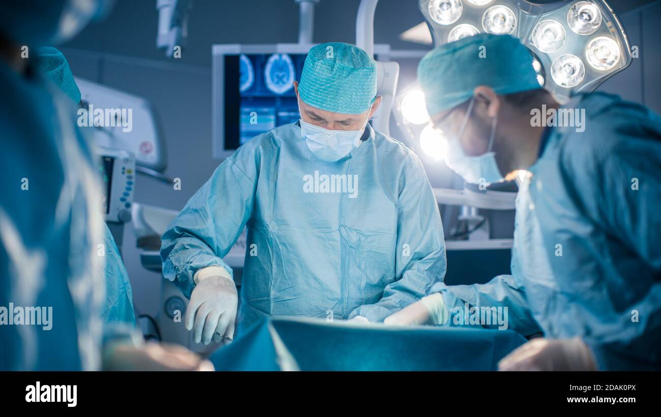 Diverse Team of Professional surgeon, Assistants and Nurses Performing ...