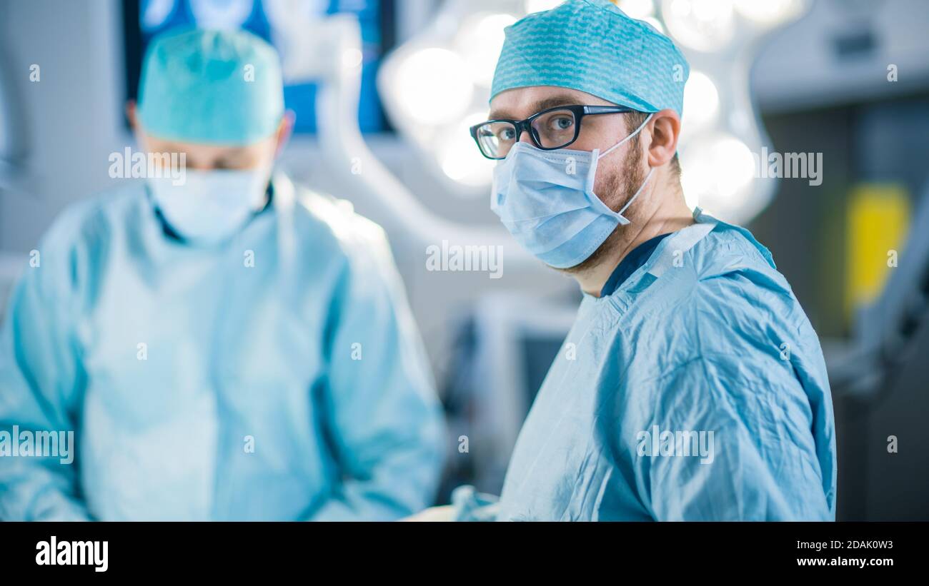 Portrait Shot of a Surgeon Looking into Camera. Diverse Team of ...