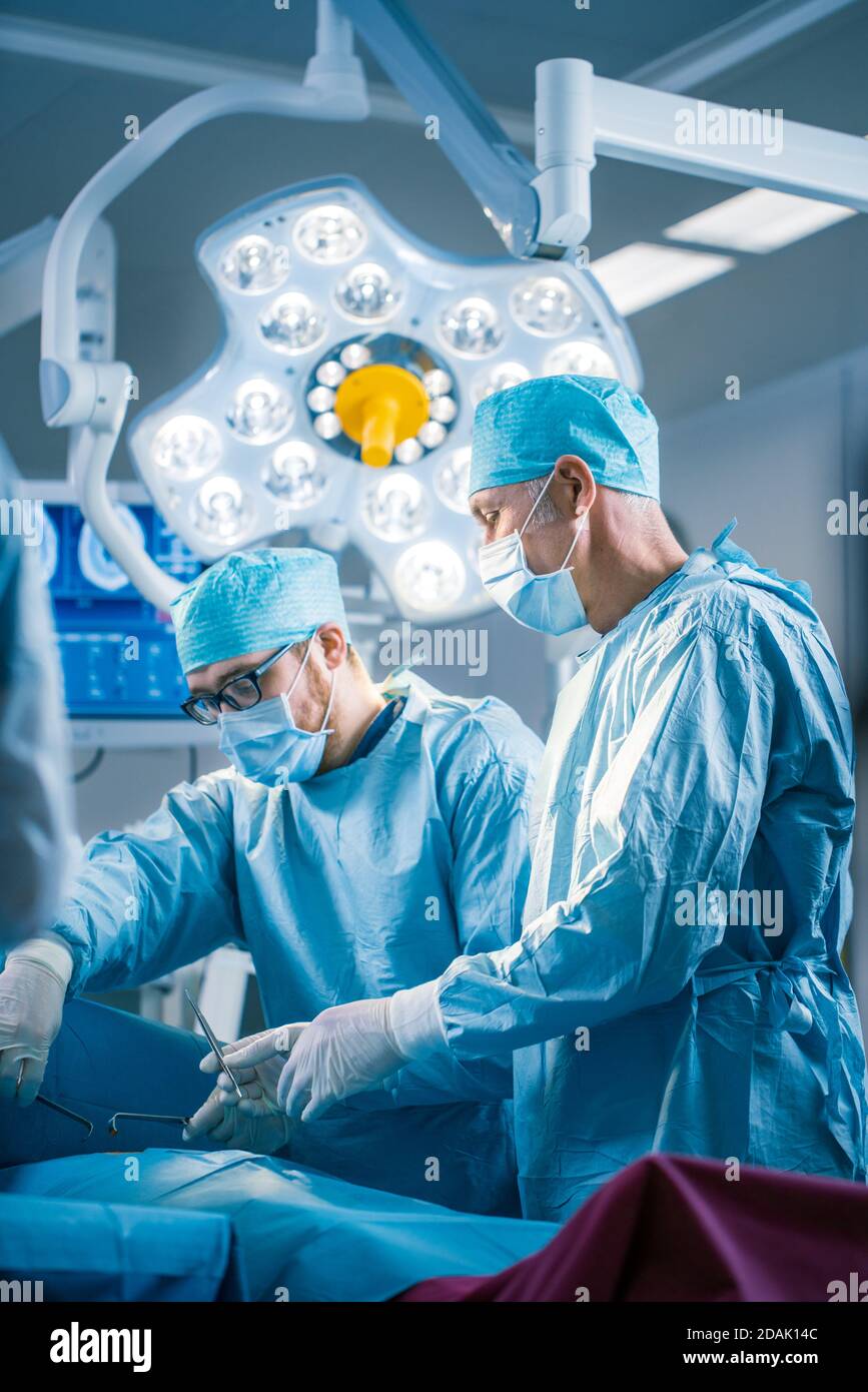 Shot In Operating Room of Two Surgeons During the Surgery Procedure ...