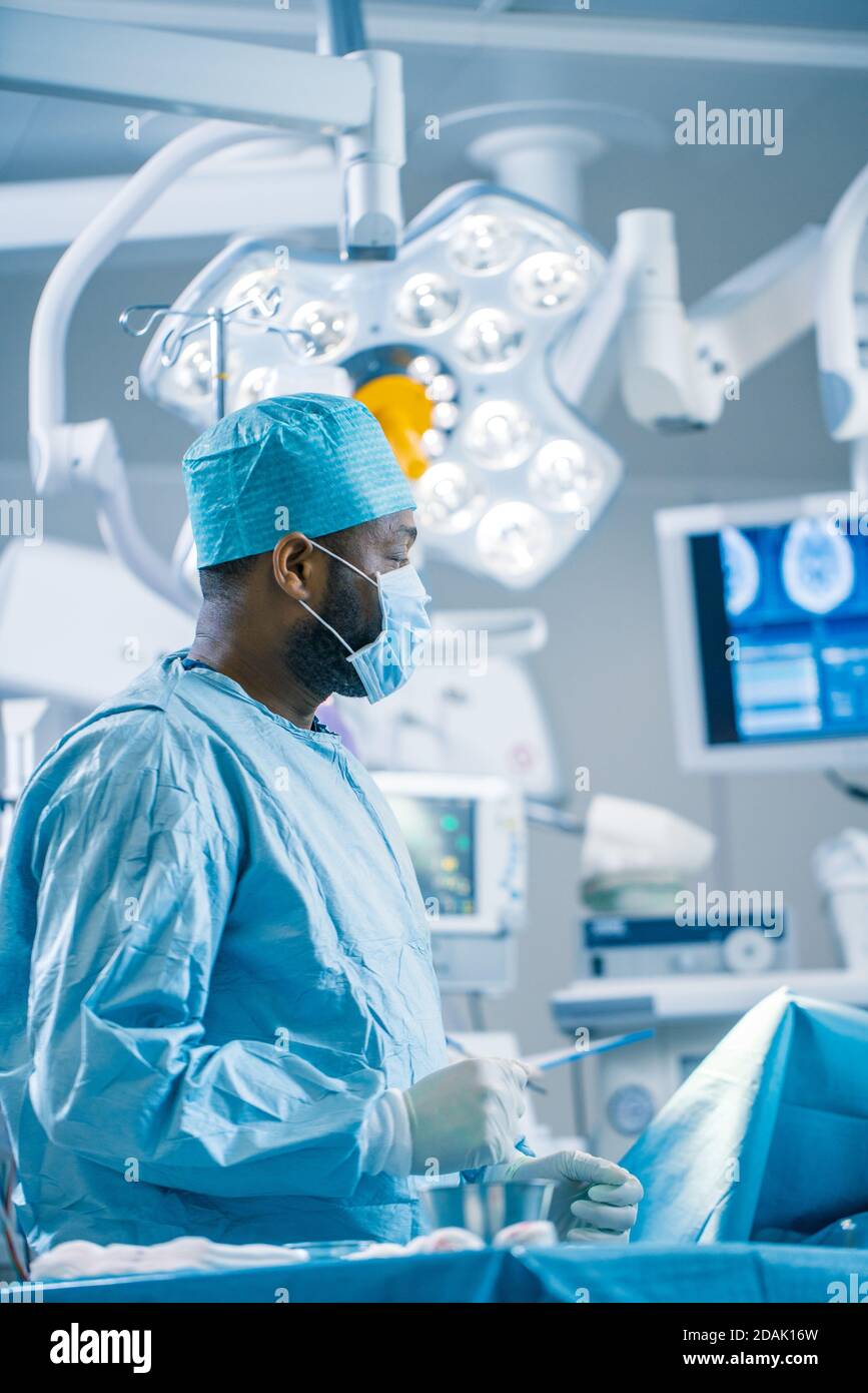 Portrait of the Black Professional Surgeon Performing Invasive Surgery ...