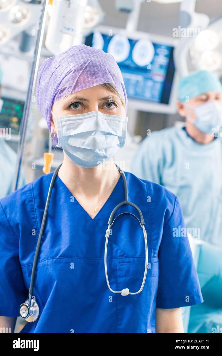 Portrait of the Professional Nurse Medical Assistant Taking off ...