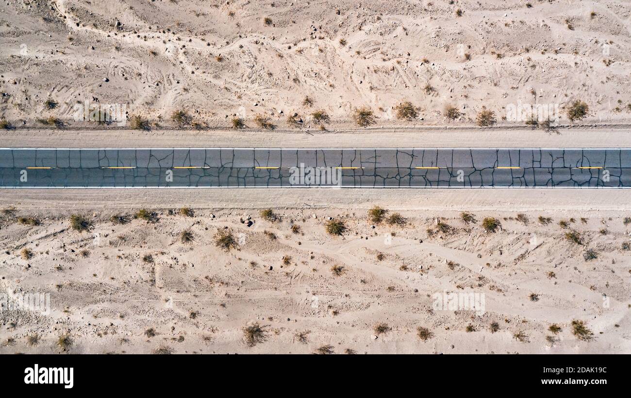 Drone view of a road crossing the desert in Death Valley Stock Photo ...
