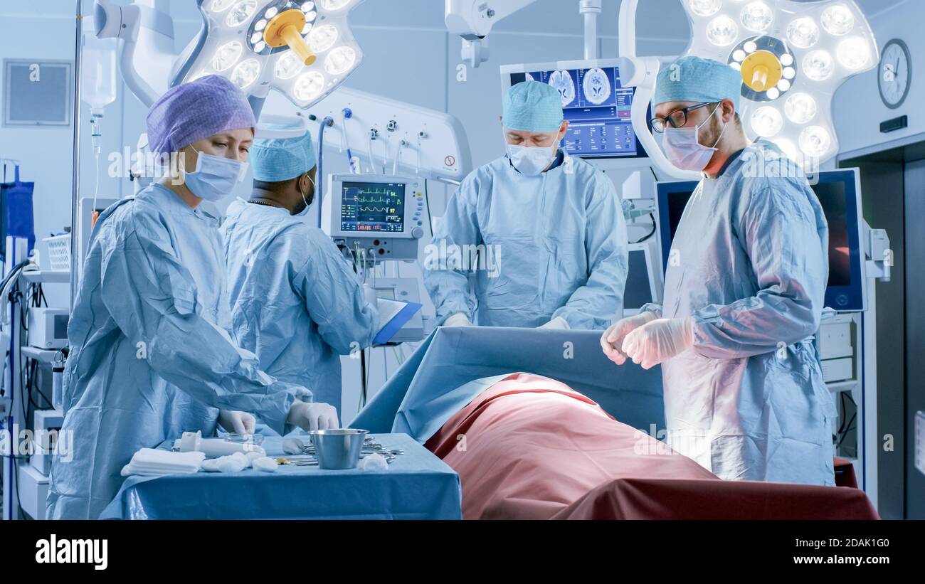 Diverse Team of Professional Surgeons Performing Invasive Surgery on a ...