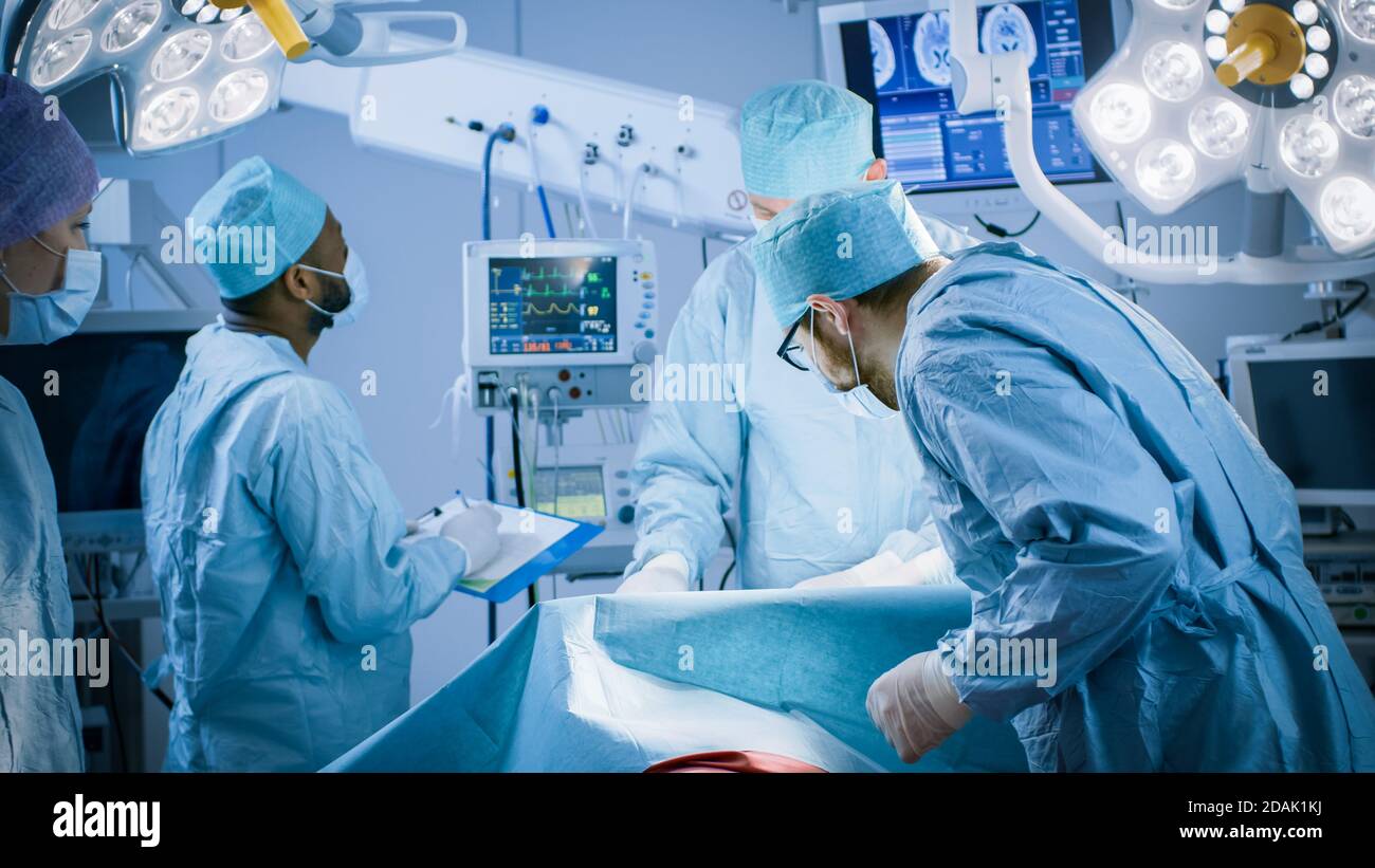 Diverse Team of Professional surgeon, Assistants and Nurses Performing ...
