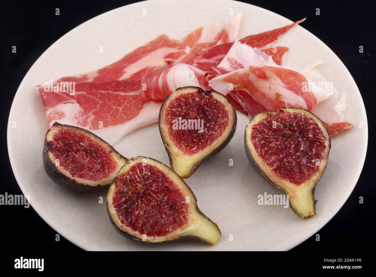 figs with ham as tasty mediterranean dish Stock Photo - Alamy