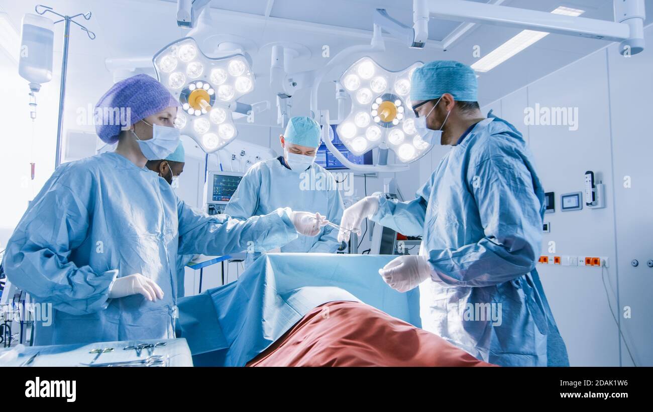 Shot of Diverse Team of Professional Surgeons Performing Invasive ...
