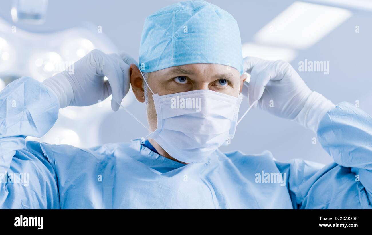 Portrait of the Professional Surgeon Putting on Surgical Mask in the ...