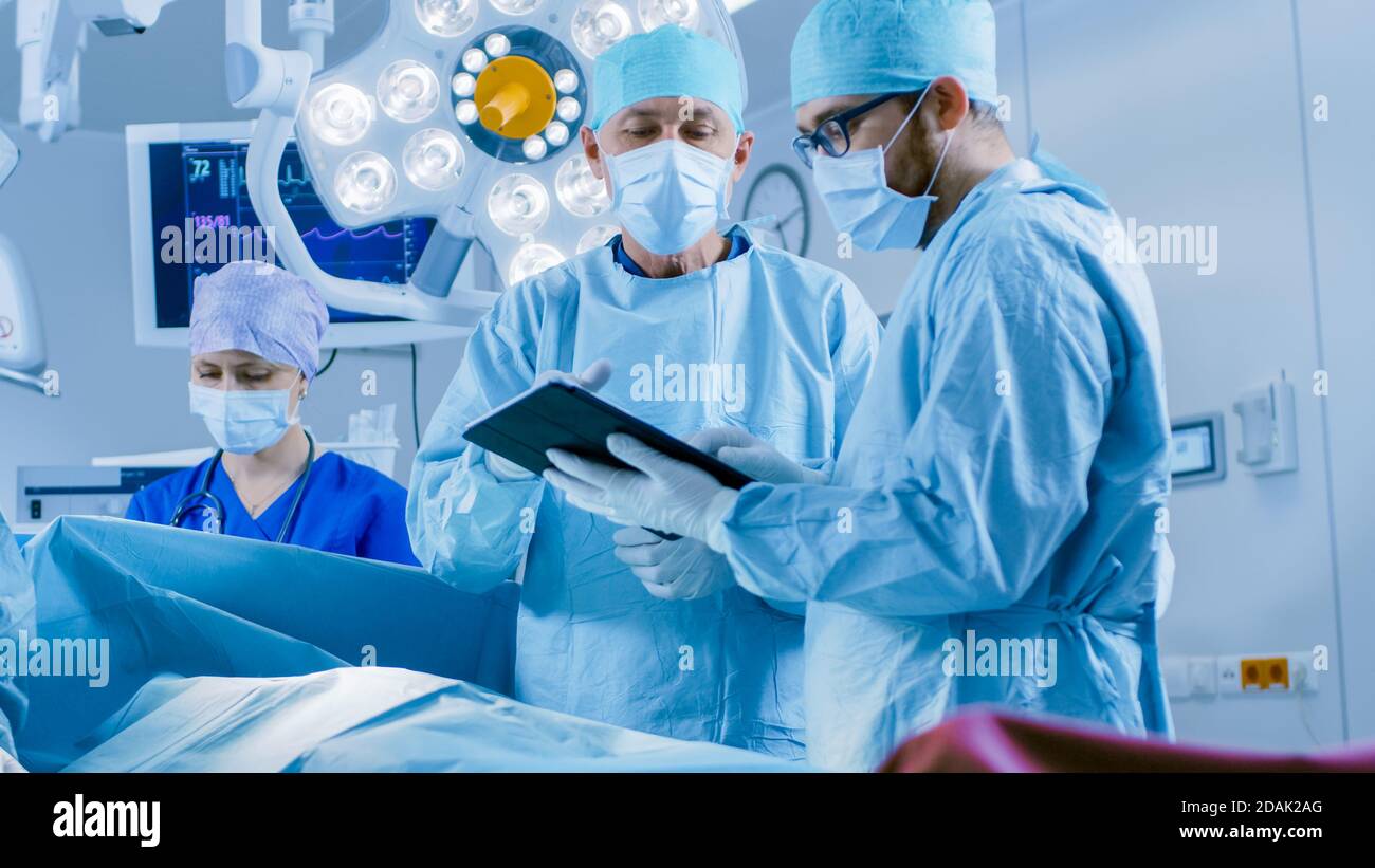 Medical team performing surgery digital hi-res stock photography and ...
