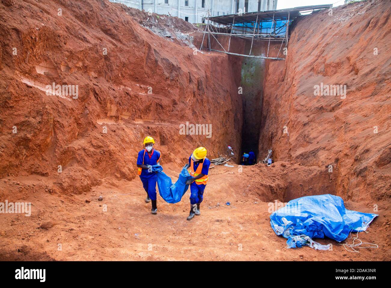 Gatsibo, Rwanda. 12th Nov, 2020. Volunteers carry remains of victims of ...