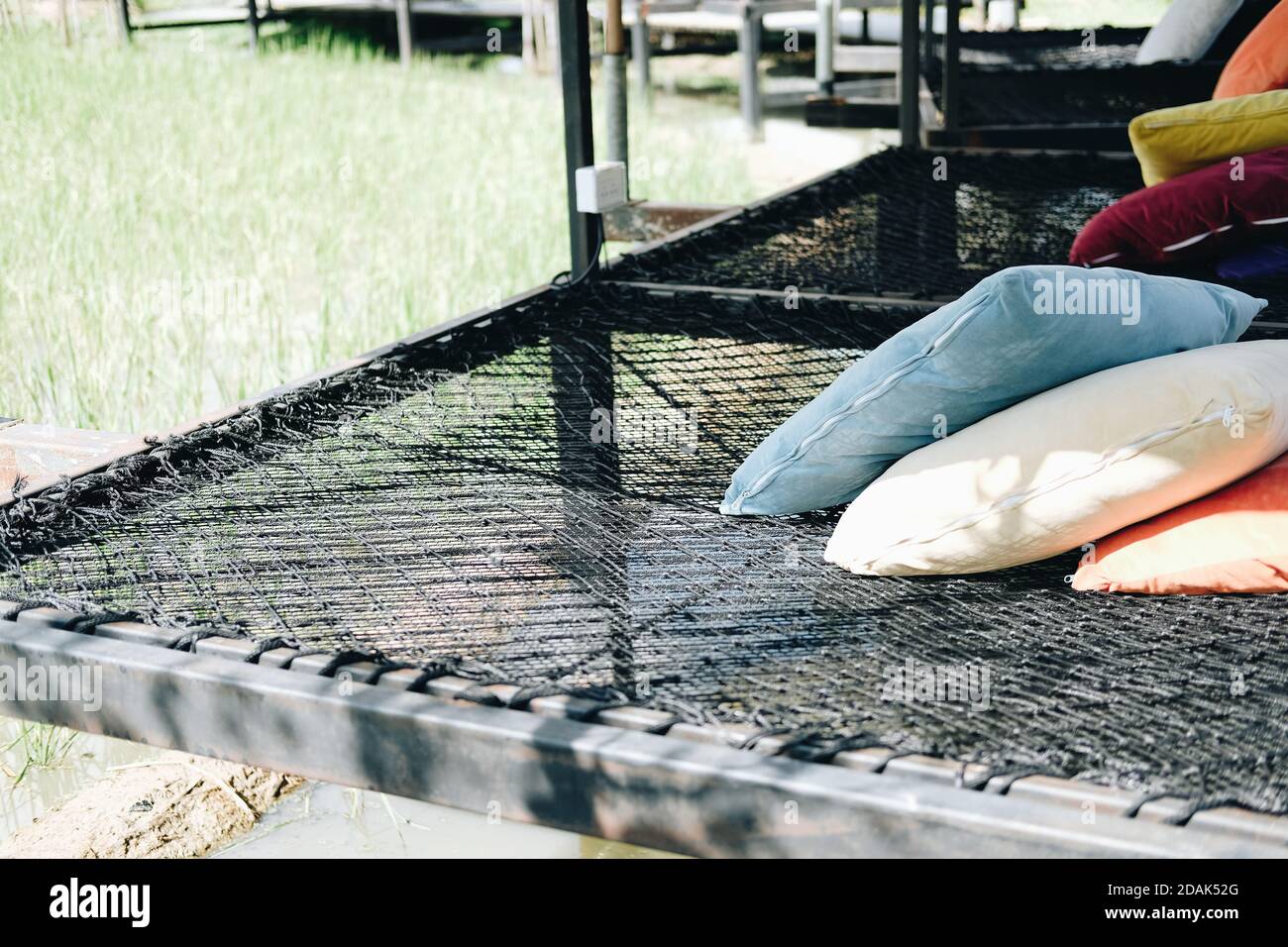 black thread rope net bed pillow for sleeping beside rice paddy field ...