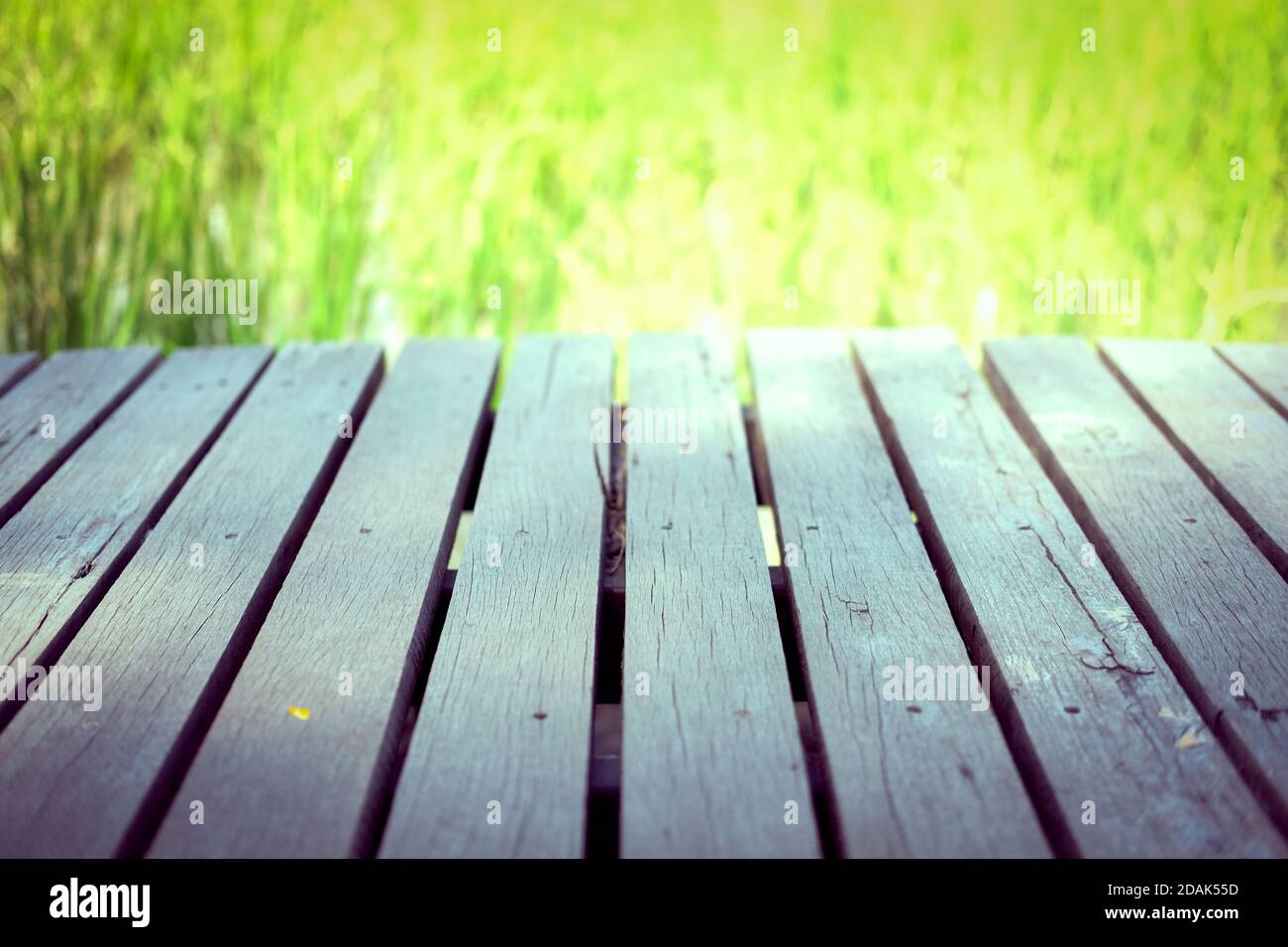 wooden table with rice paddy field background for montage display ...