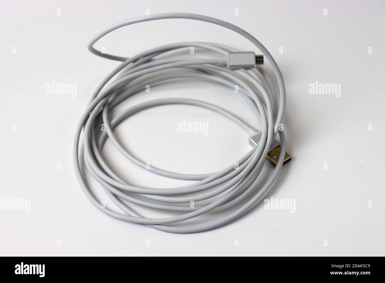 Twisted long usb cable isolated on white background Stock Photo - Alamy