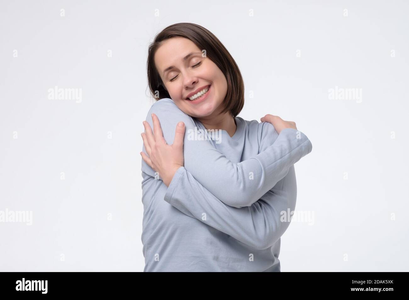 Self hug hi-res stock photography and images - Alamy
