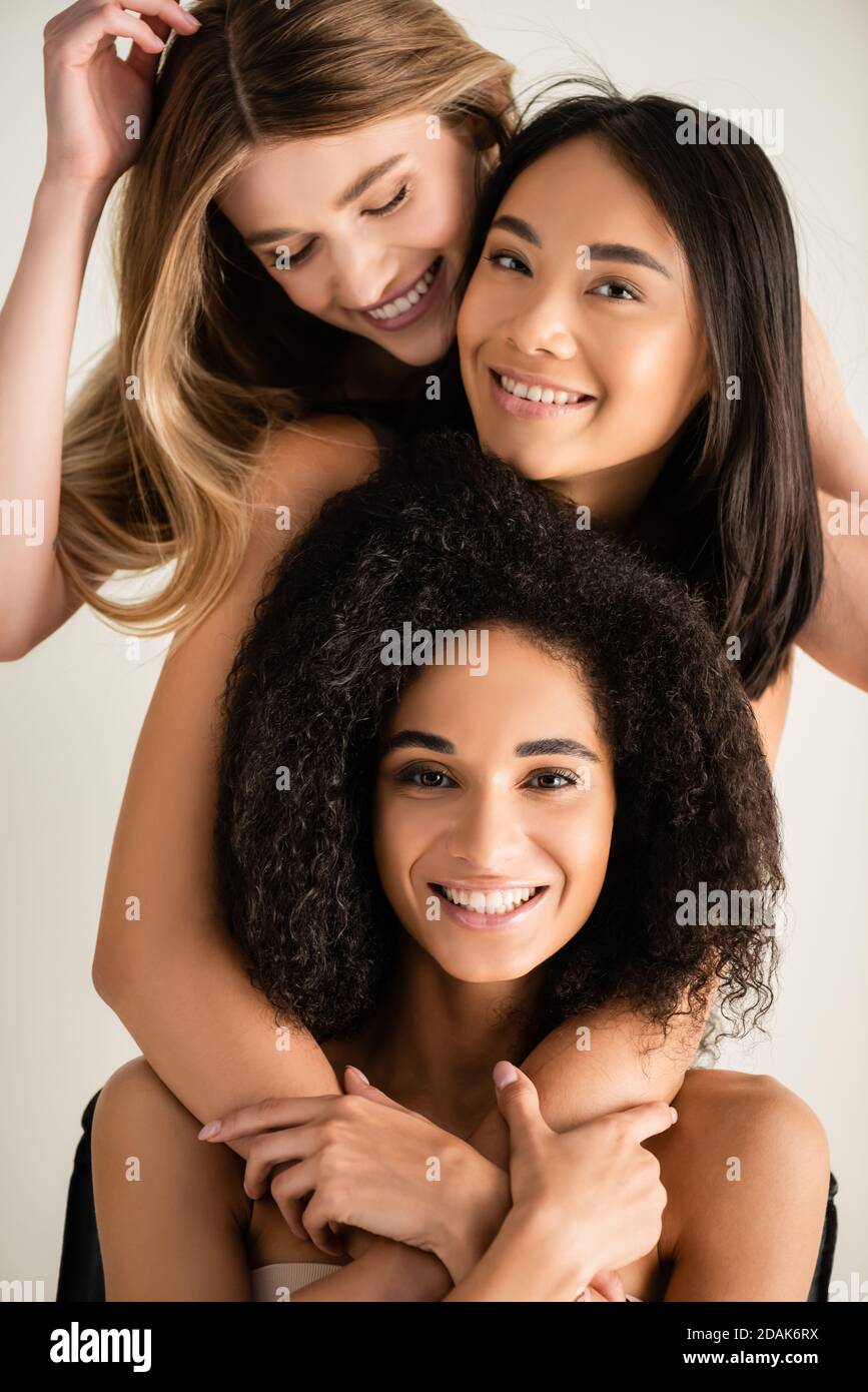 young multicultural models smiling isolated on white Stock Photo - Alamy