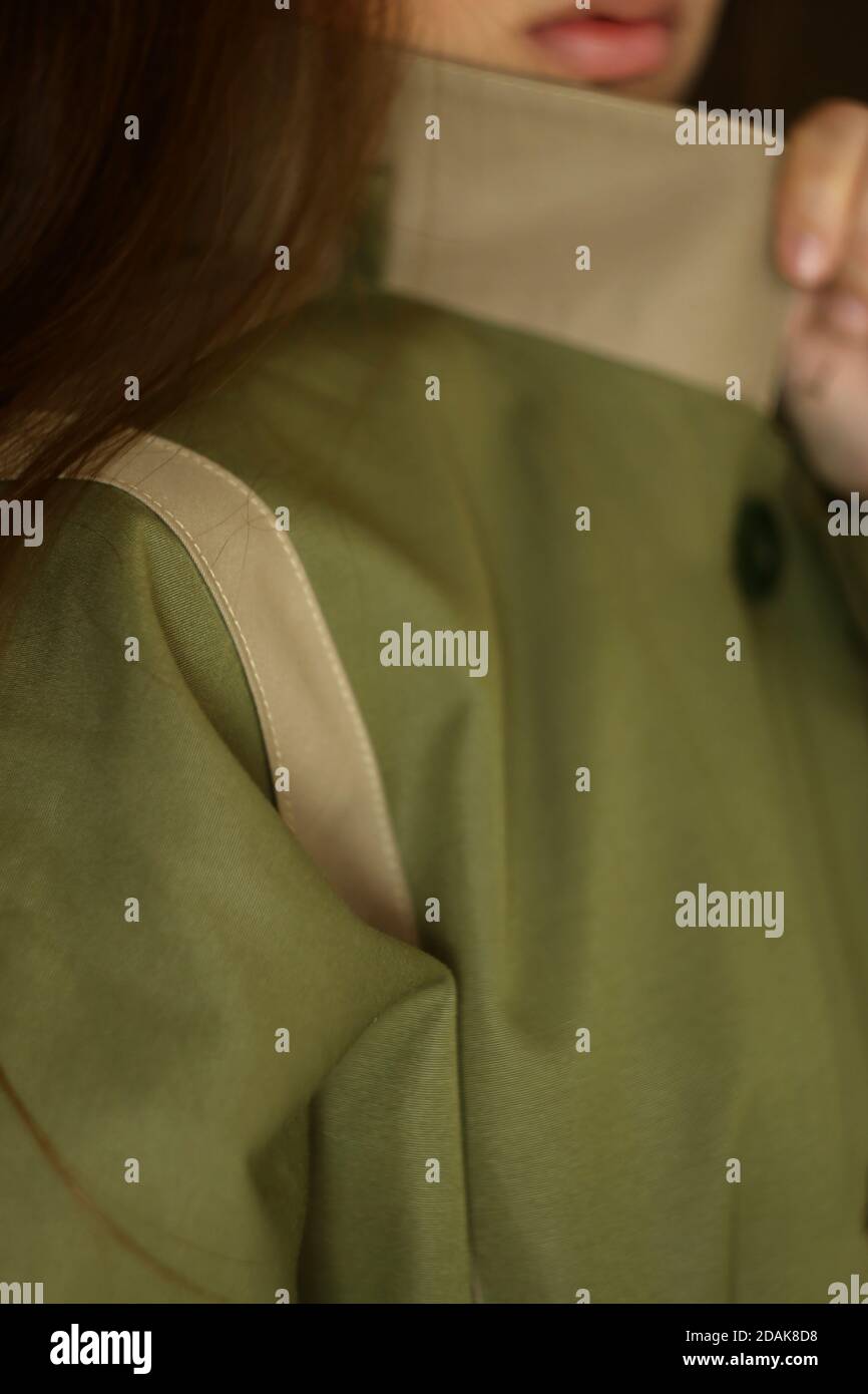 Elements and details of outerwear. Stylish green autumn trench coat ...