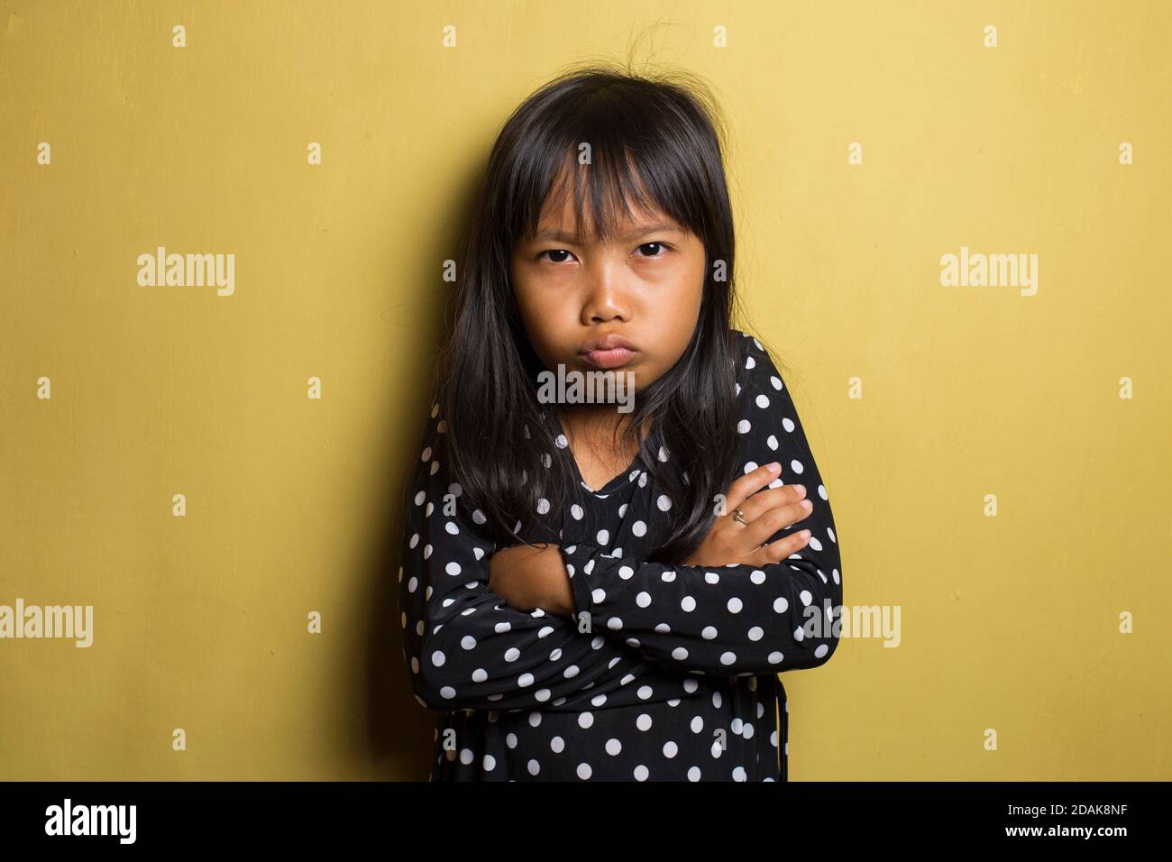 Portrait of an upset unsatisfied asian little girl looking away Stock ...