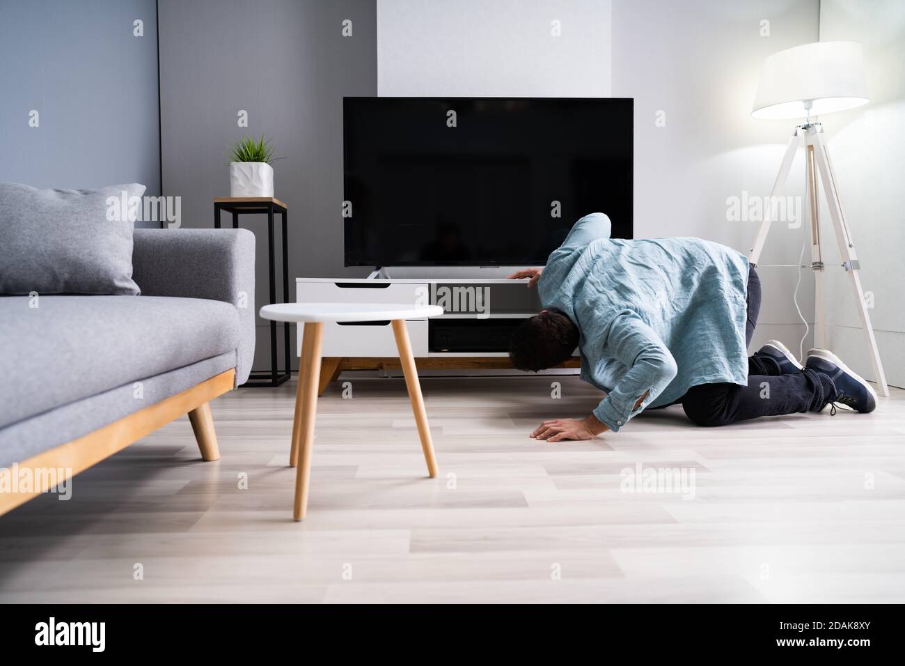 Lost Something Looking For Things. Searching Keys Stock Photo - Alamy