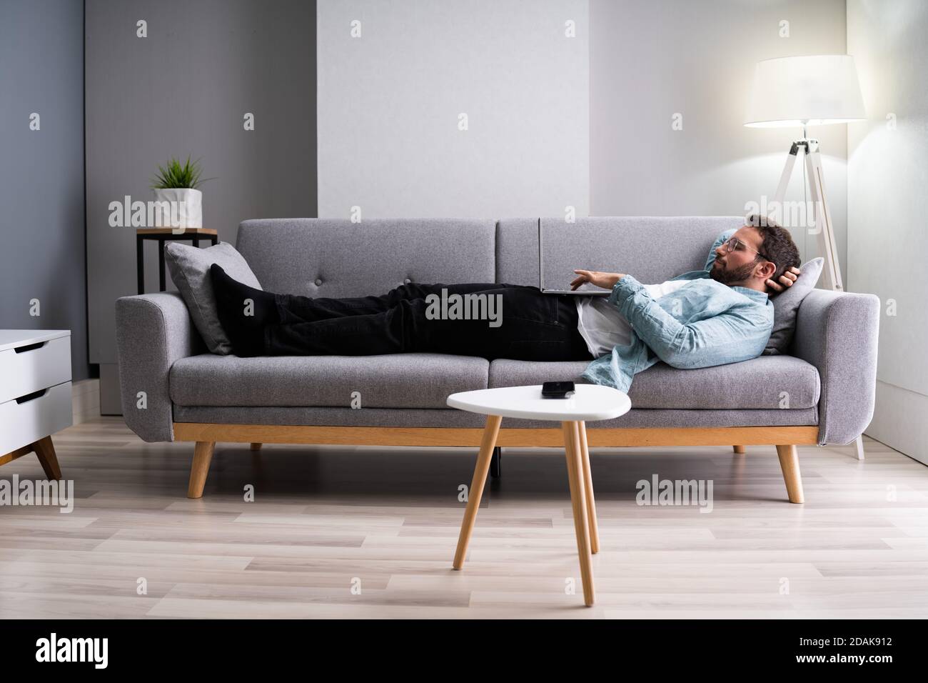 Male couch tv hi-res stock photography and images - Alamy